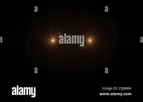 Abstract gold orange optical shine light lens flares moving to center ...