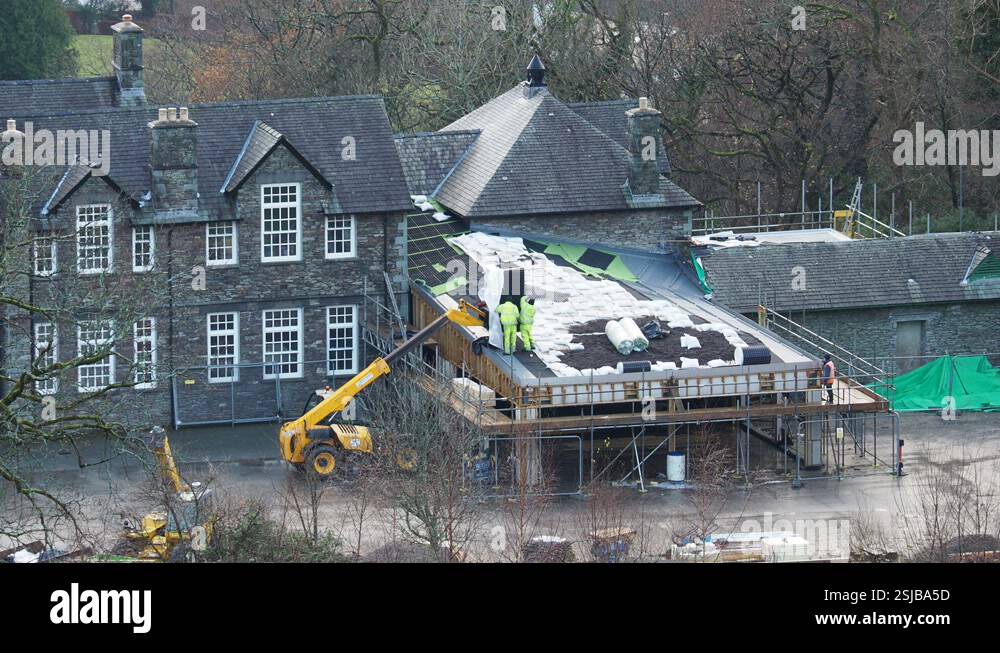Workmen work on a new green roof extension to the old Kelsick Grammar ...