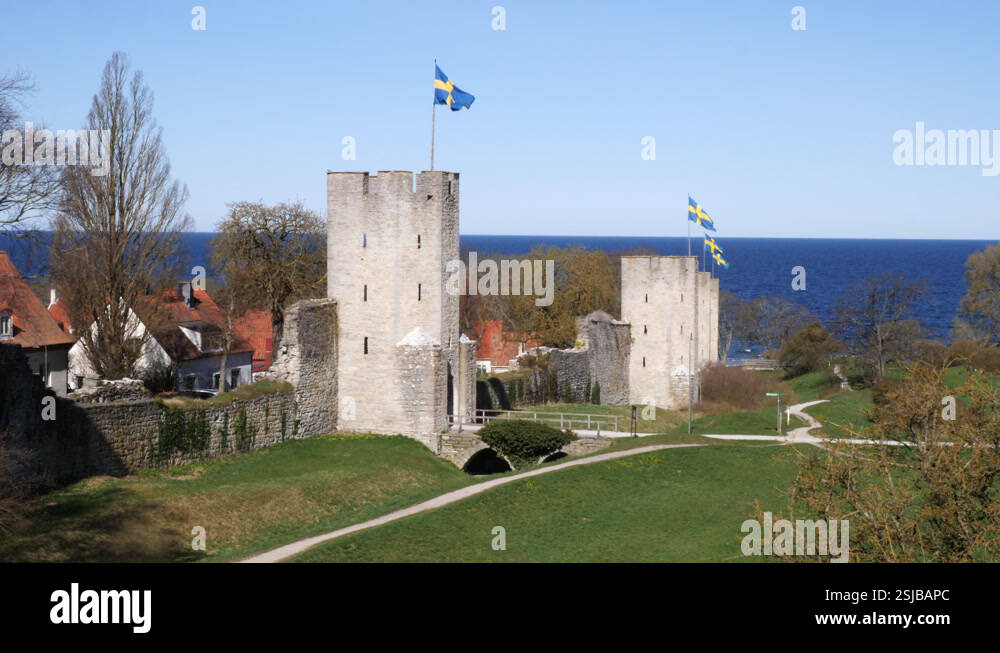 Visby medieval wall and old town in Gotland, Sweden with the Swedish ...