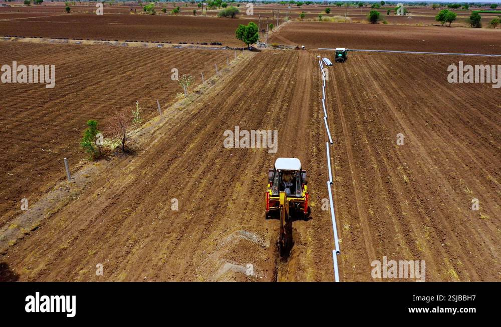 Aerial Camera moving above the excavation water pipe and large water ...