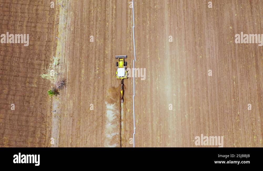 Aerial top angle view, Camera moving back to an excavation digging soil ...