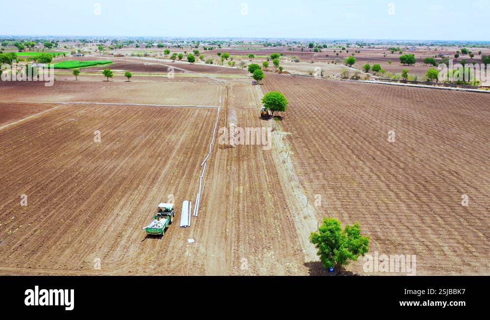 extreme wide angle view of Indian agricultural land in India at hot ...