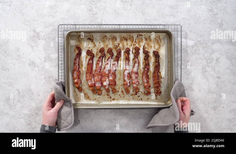 Flat lay. Step by step. Cooked bacon strips on a baking sheet with ...