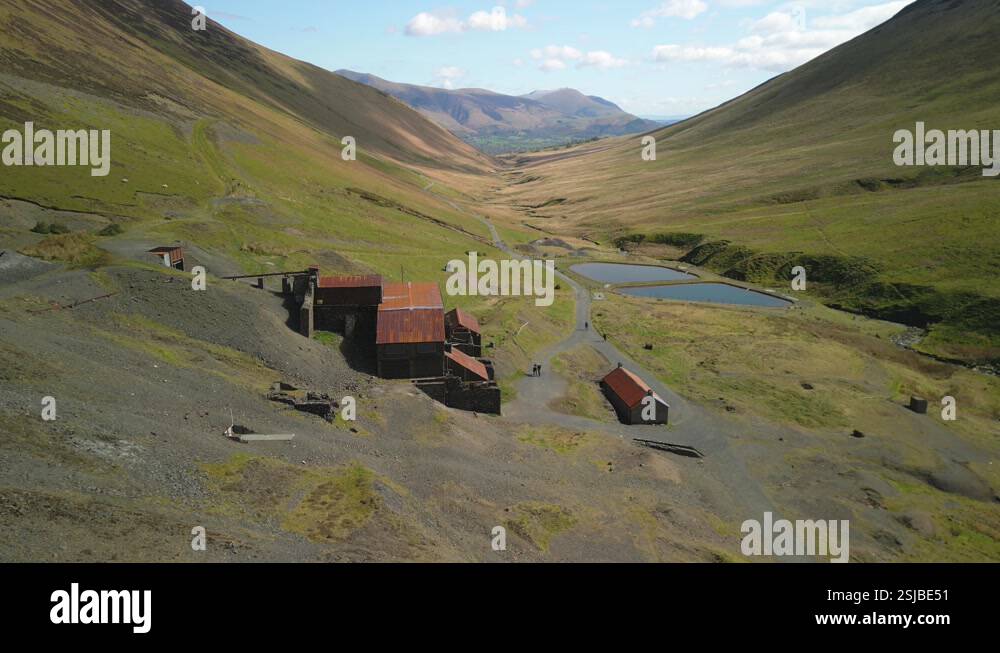 Rusty tin roofs of abandoned mine at Force Crag Mine Coledale Beck in ...