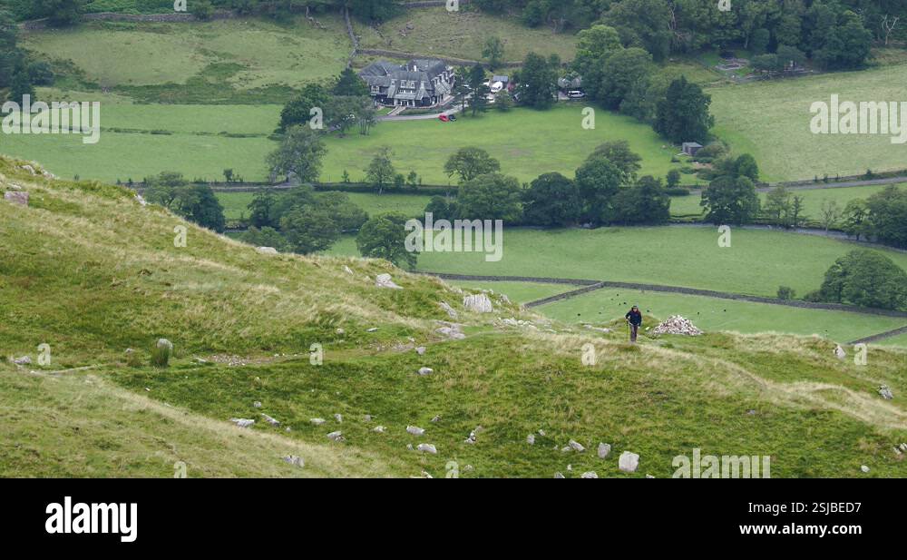 A man hiking up Glaramara in Borrodale, Lake District, UK Stock Video ...