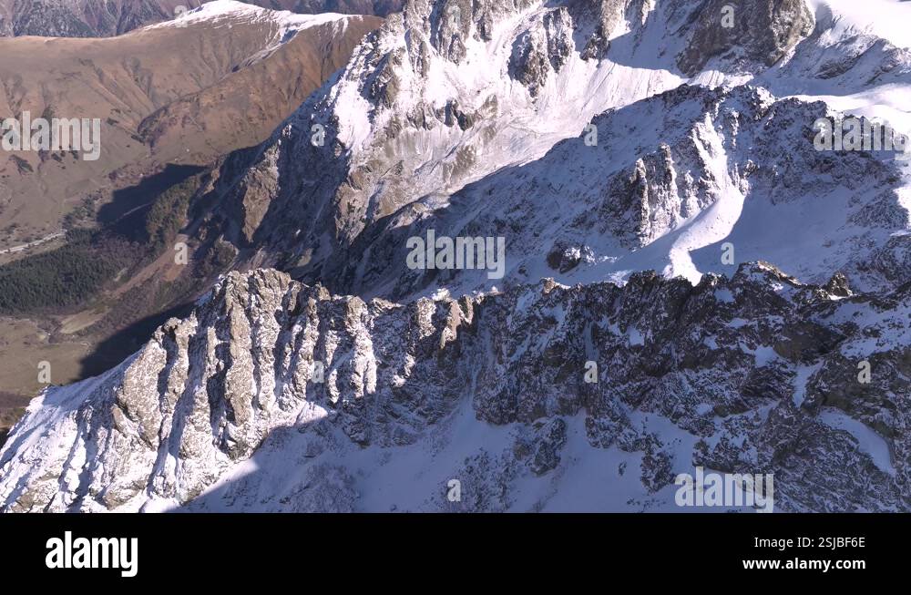 Alps, mountain snow-covered range, top view. Frozen mountain lakes in ...