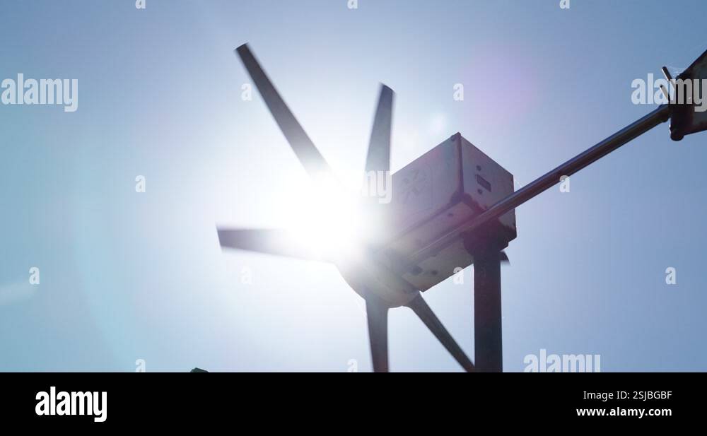 An illuminated road sign powered by a solar panel and wind turbine ...
