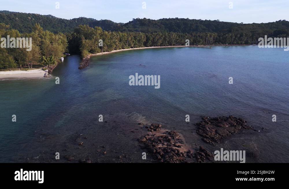 beach wooden pier offshore island lagoone bay. Dramatic aerial top view ...