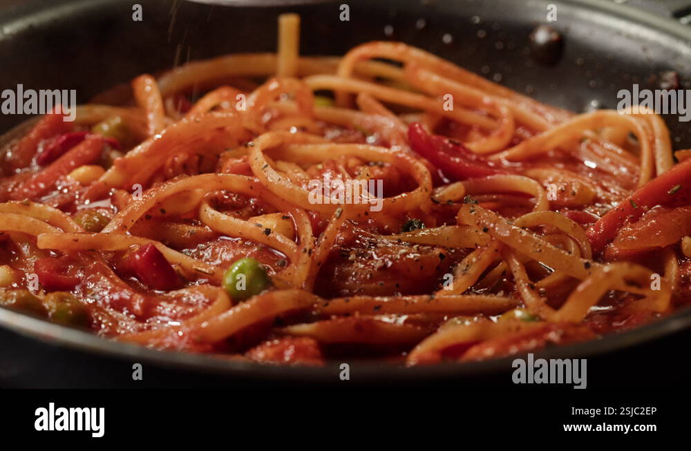 Chef cooking tomato Italian bolognese fresh pasta with tomato sause ...