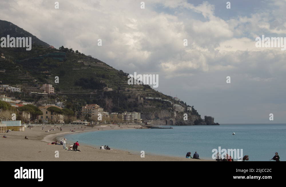Relaxing Maiori coastline beach with tourists and beachgoers, Italy ...