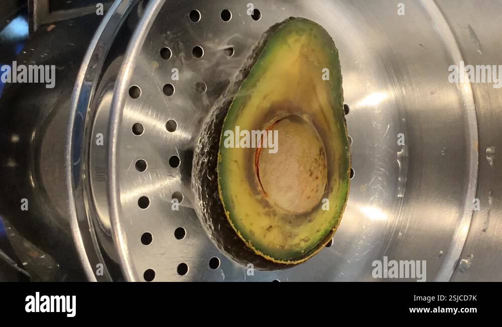 frozen half avocado steaming on a hot steamer Stock Video Footage - Alamy