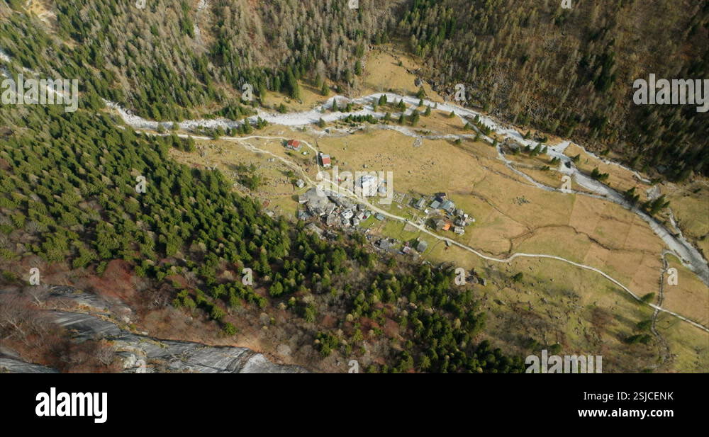 Aerial view of a quaint village community in the middle of valley of ...