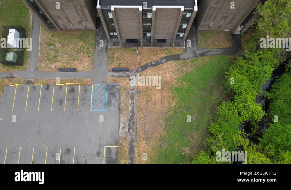 An aerial view of a unique building with many square skylights on the ...