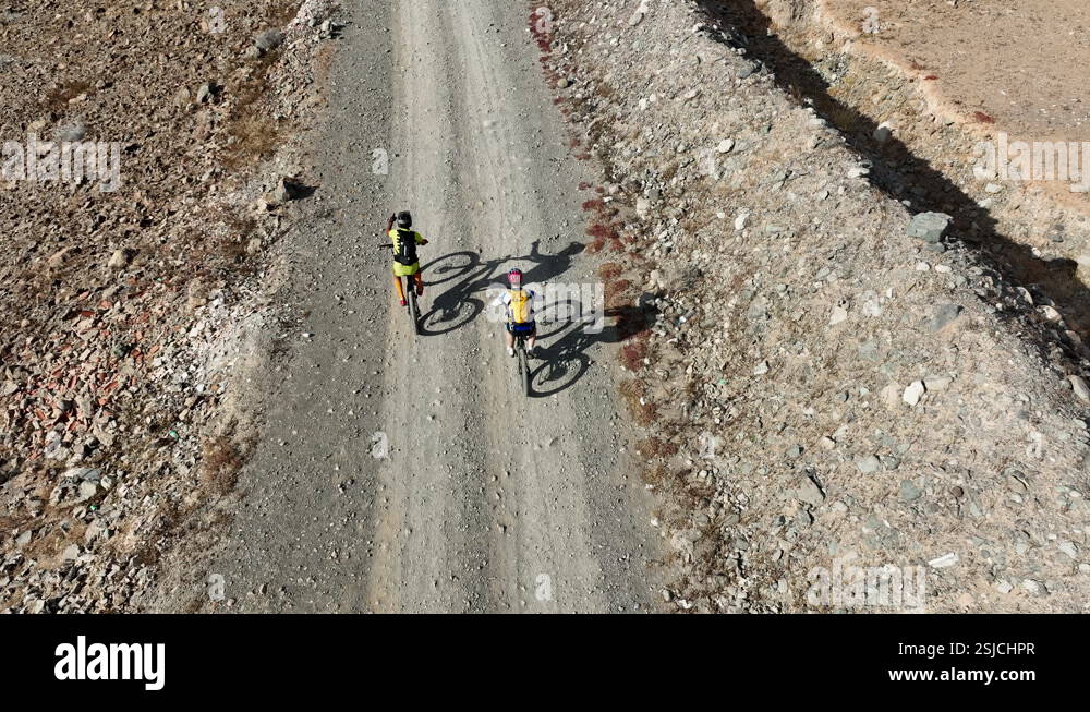 Fantastic aerial shot of two men on their talking mountain bikes ...