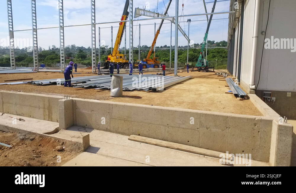 DRONE, Workers Carry Heavy Steel Beam as Cranes Lift Up on Construction ...