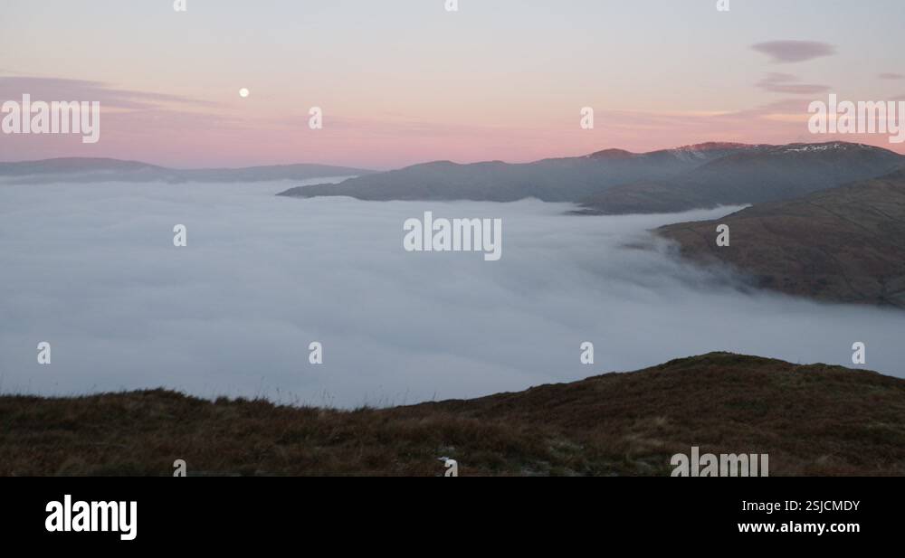 Valley mist from a temperature inversion at dawn on Wansfell, Ambleside ...