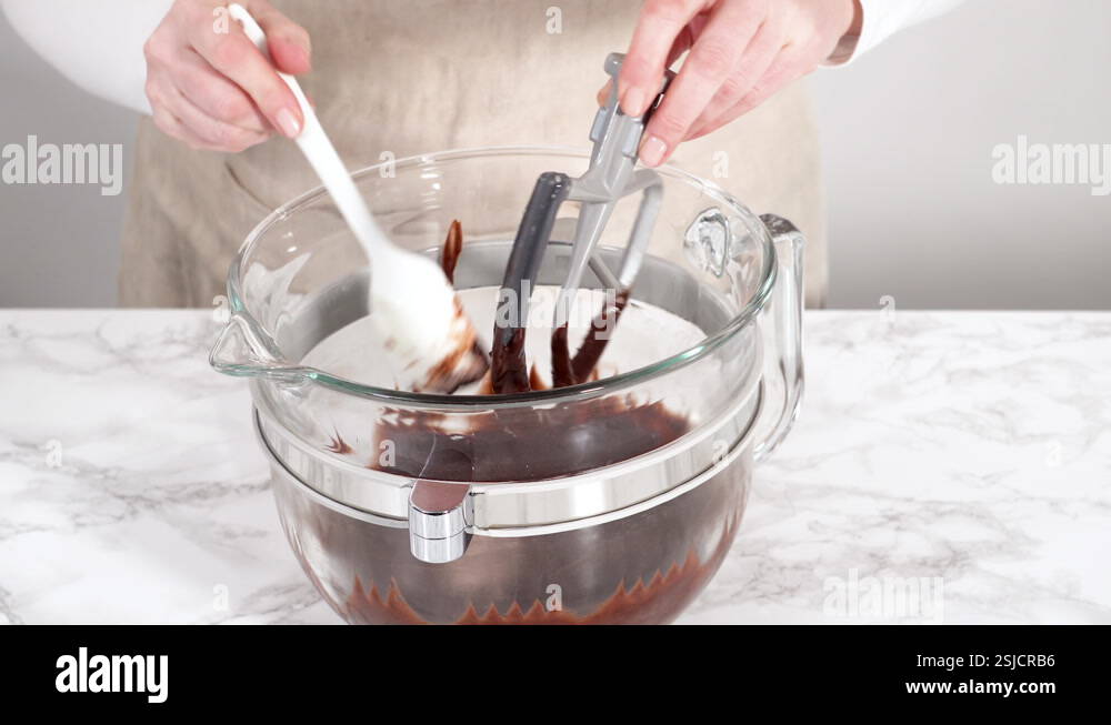 Mixing ingredients in kitchen mixer to bake a chocolate cupcake Stock ...