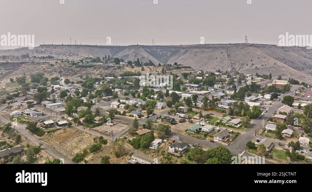 Maupin Oregon Aerial v1 cinematic drone flyover town with buildings on ...