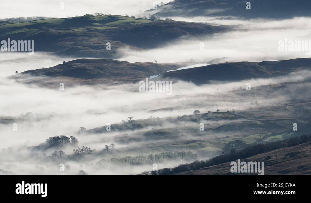 Looking down on Beacon Tarn on Torver Common from the Coniston fells ...