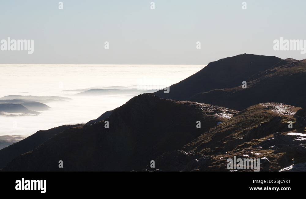 Looking over Coniston Water from Swirl Howe with mist from a ...
