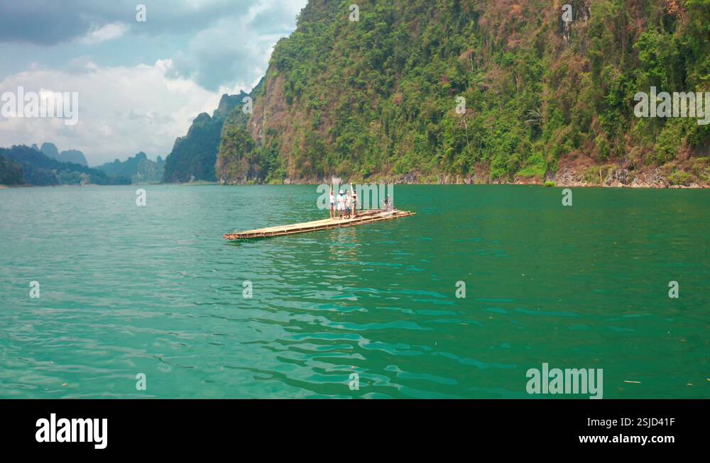 Group of friends on a bamboo raft float on Cheow Lan Lake, Khao Sok ...