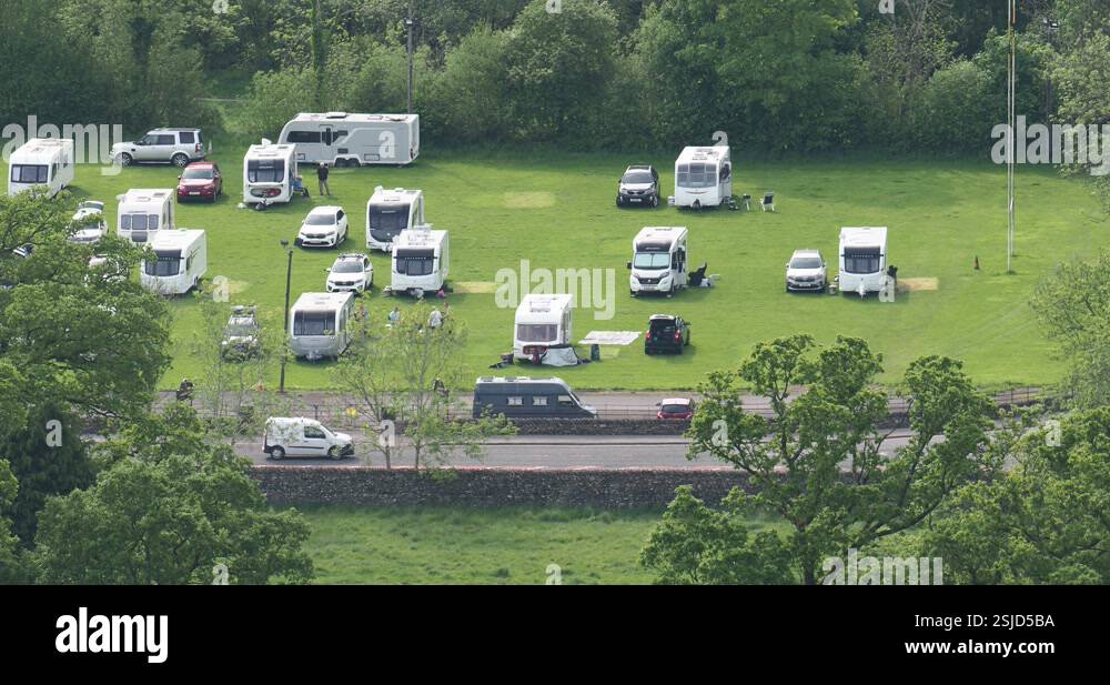 A caravan club meet on the rugby pitch in Ambleside, Lake District, UK ...