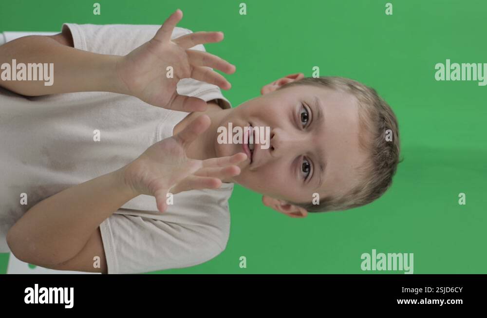 Boy of 9 years behaves very surprised. Green screen.Closeup Stock Video ...