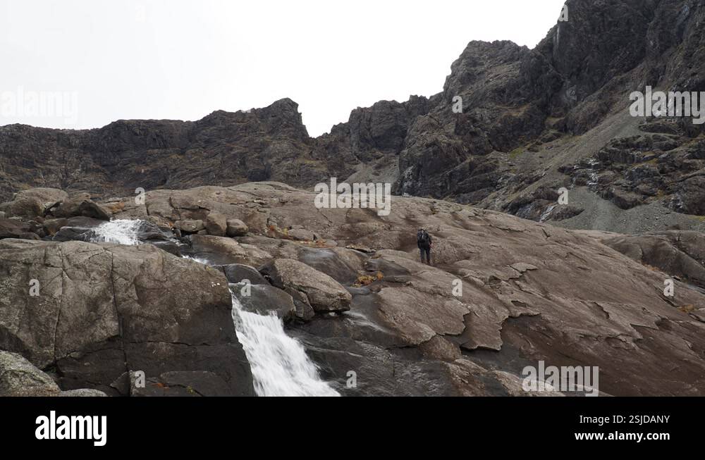 A waterfall coming out of Coire Lagan below Sgurr Mhic Choinnich; and ...