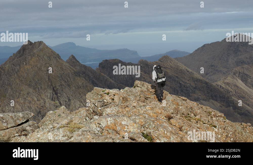 A climber on Sguur Dearg on the Cuillin Ridge, Isle of skye, Scotland ...