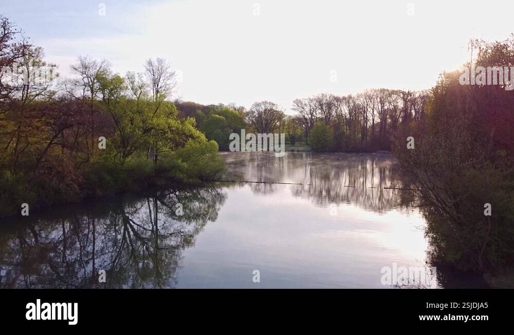 beautiful calm lake with fog in the morning and low sun, cologne Stock ...