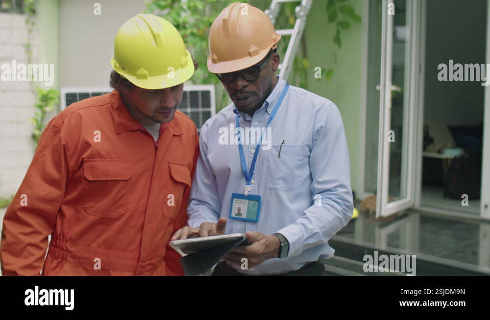 Engineer Giving Instructions about Solar Panels to Worker Stock Video ...