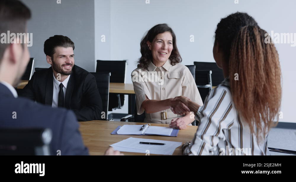 Two business lady shaking hands after coming to agreement Stock Video ...