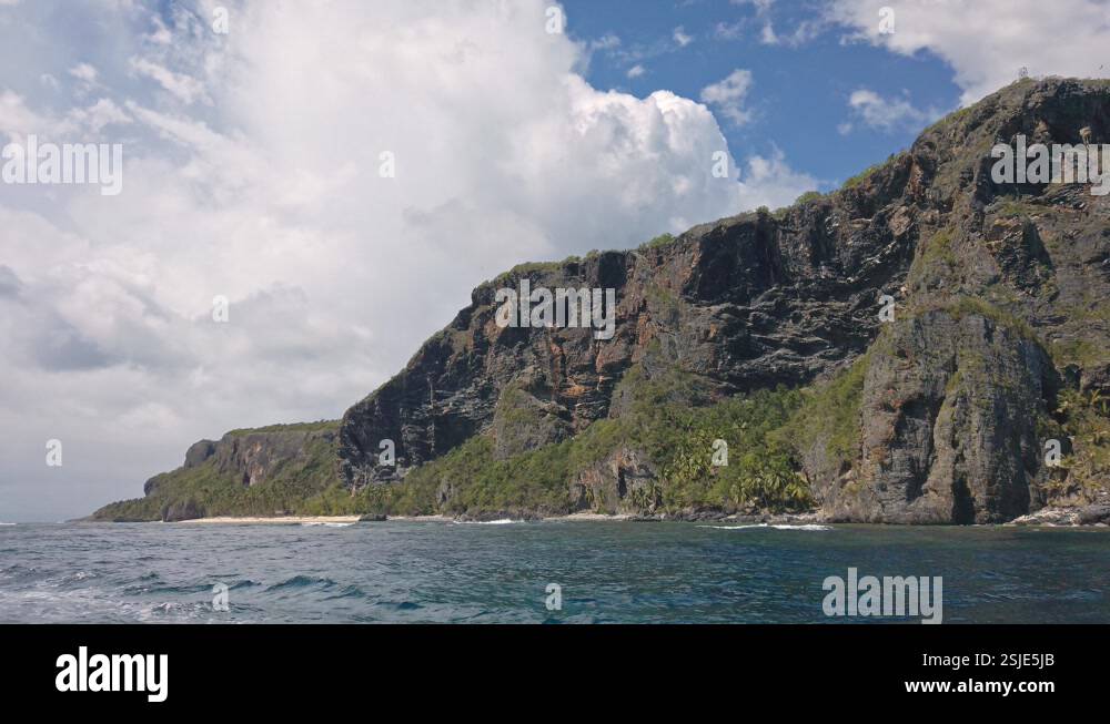 Sightseeing on boat with Playa Fronton beach and cliff in background ...