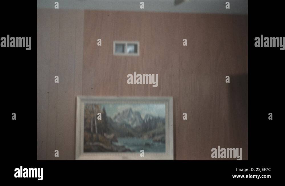 1960s: Clapperboard. Inside of hotel room. Air vent near ceiling. Air ...