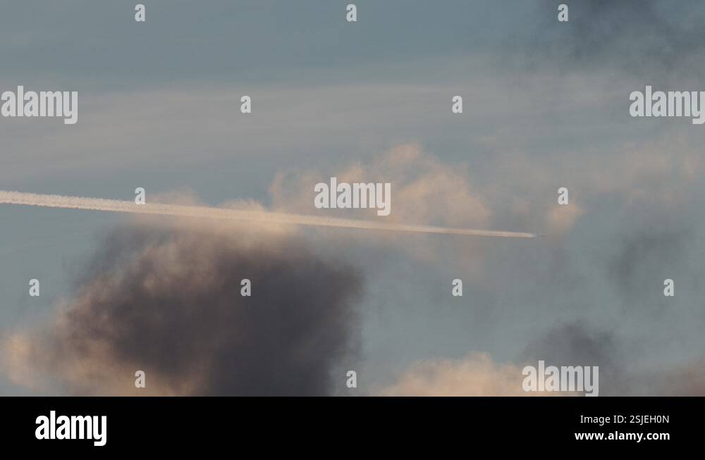 Emissions from a plane over Ambleside, UK Stock Video Footage - Alamy