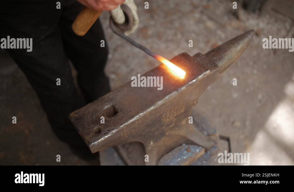 A blacksmith reenactor brings history to life by portraying a ...