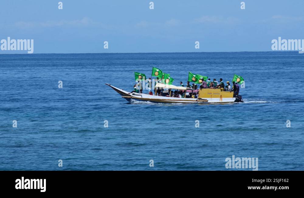 People holding political party flags on a local boats for upcoming ...