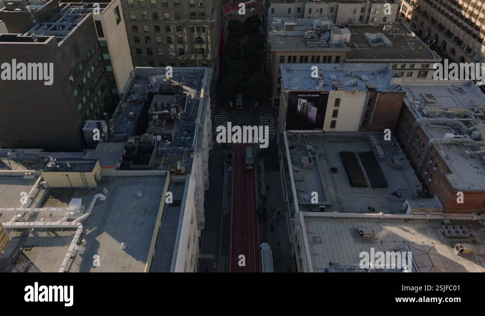 Fly above street in urban borough. multistorey buildings and historic ...