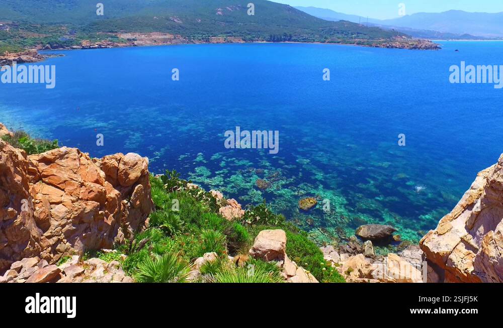 shot of the sea of an island in jijel with a beautiful blue color of ...