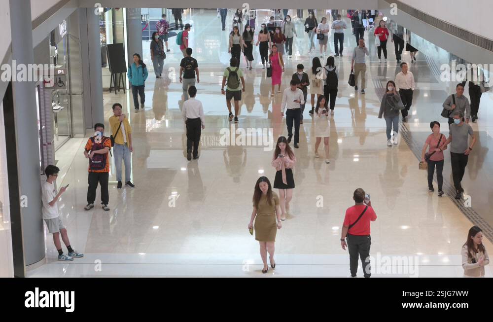 Shoppers walk through a high-end shopping mall as they look for Stock ...
