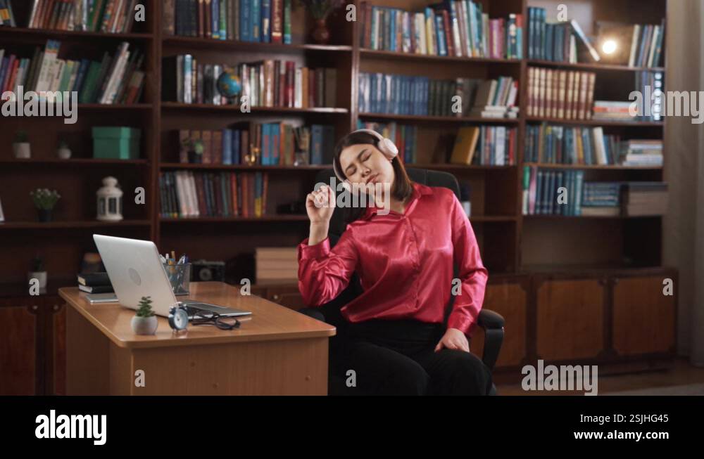 Young woman sits behind desk Stock Videos & Footage - HD and 4K Video ...