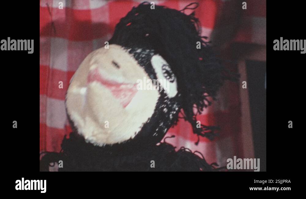 1970s: Puppet crow looks around puppet theater. Puppet woman looks at ...