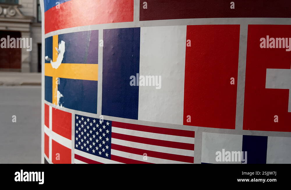 City of Multiculturalism: National Flags on a Billboard Reflect ...