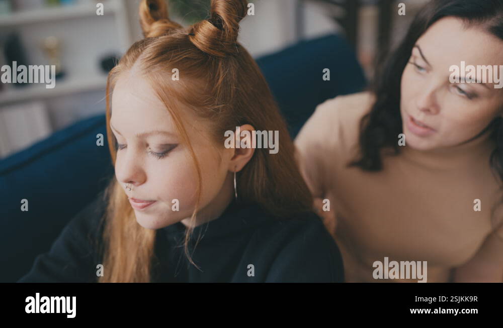 Teen girl with face piercings ignoring her mom, teenage rebellion ...
