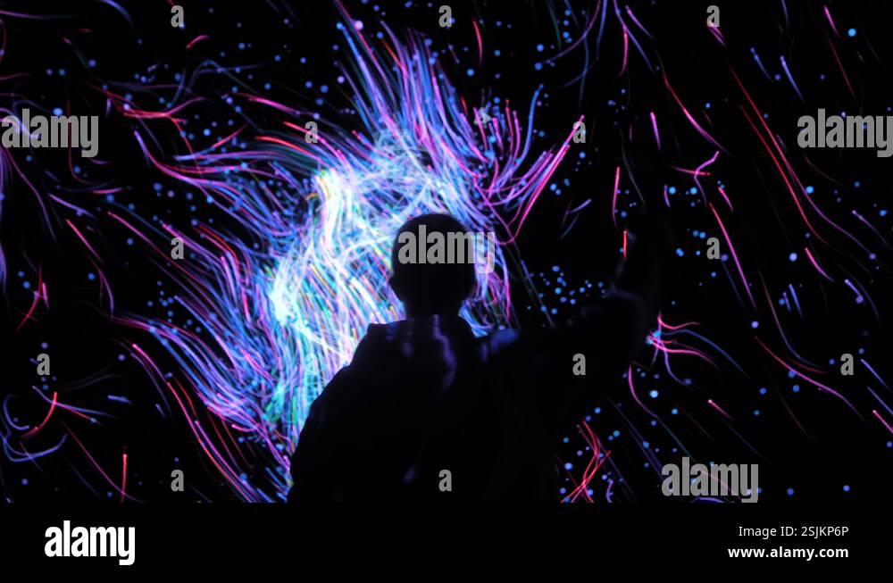 Woman moving in front of large AR display with mirror effect at ...