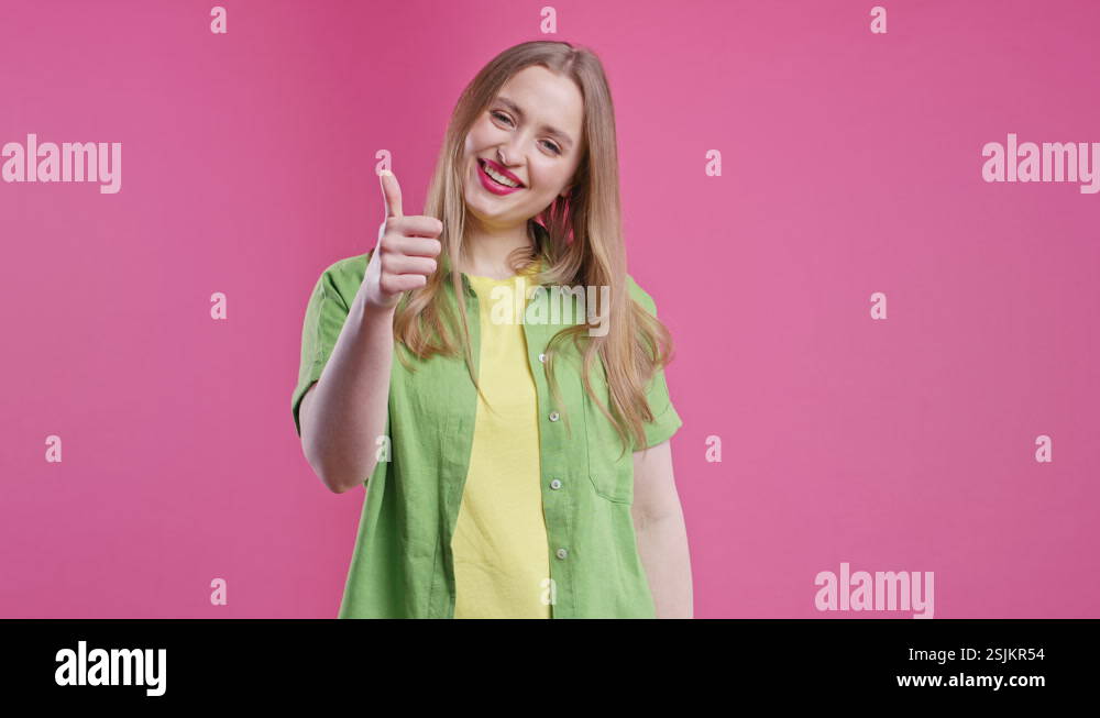 Pretty woman with hand sign like, thumbs up gesture. Lady on pink ...