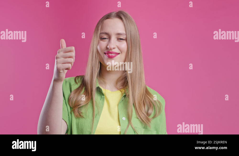 Pretty woman with hand sign like, thumbs up gesture. Lady on pink ...