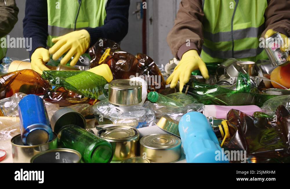 Recycling Sorting Center. Waste sorting belt. Hand separation of waste ...