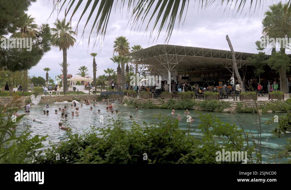 People enjoy bathing in ancient Turkish hot mineral spring water spa ...