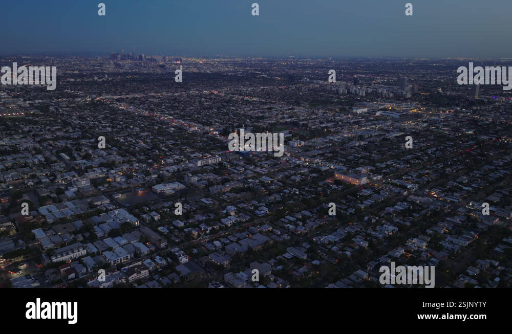 Fly above large city. houses in residential boroughs and high rise ...